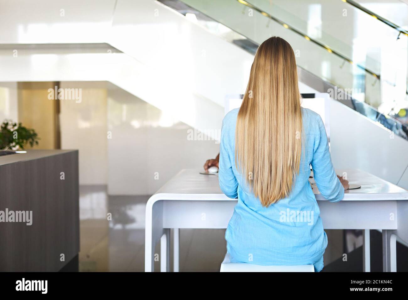 Rear view sitting at computer hi-res stock photography and images - Alamy