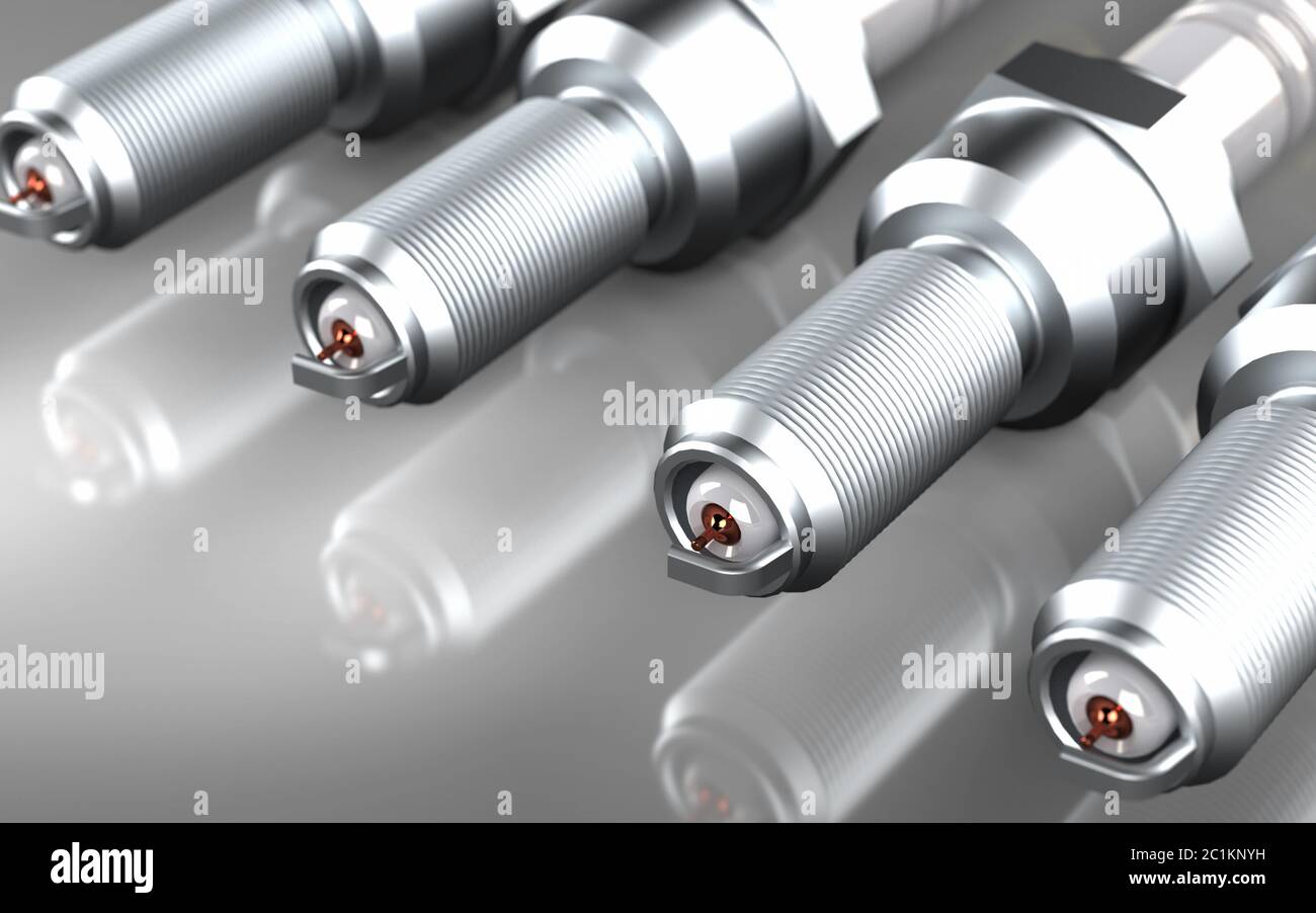 Several spark plugs on the grey background Stock Photo - Alamy