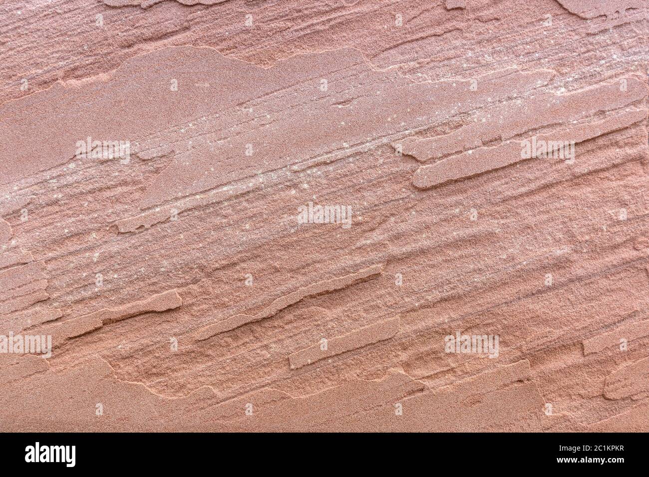 Red sandstone slab with slanted, diagonal texture in close-up Stock ...