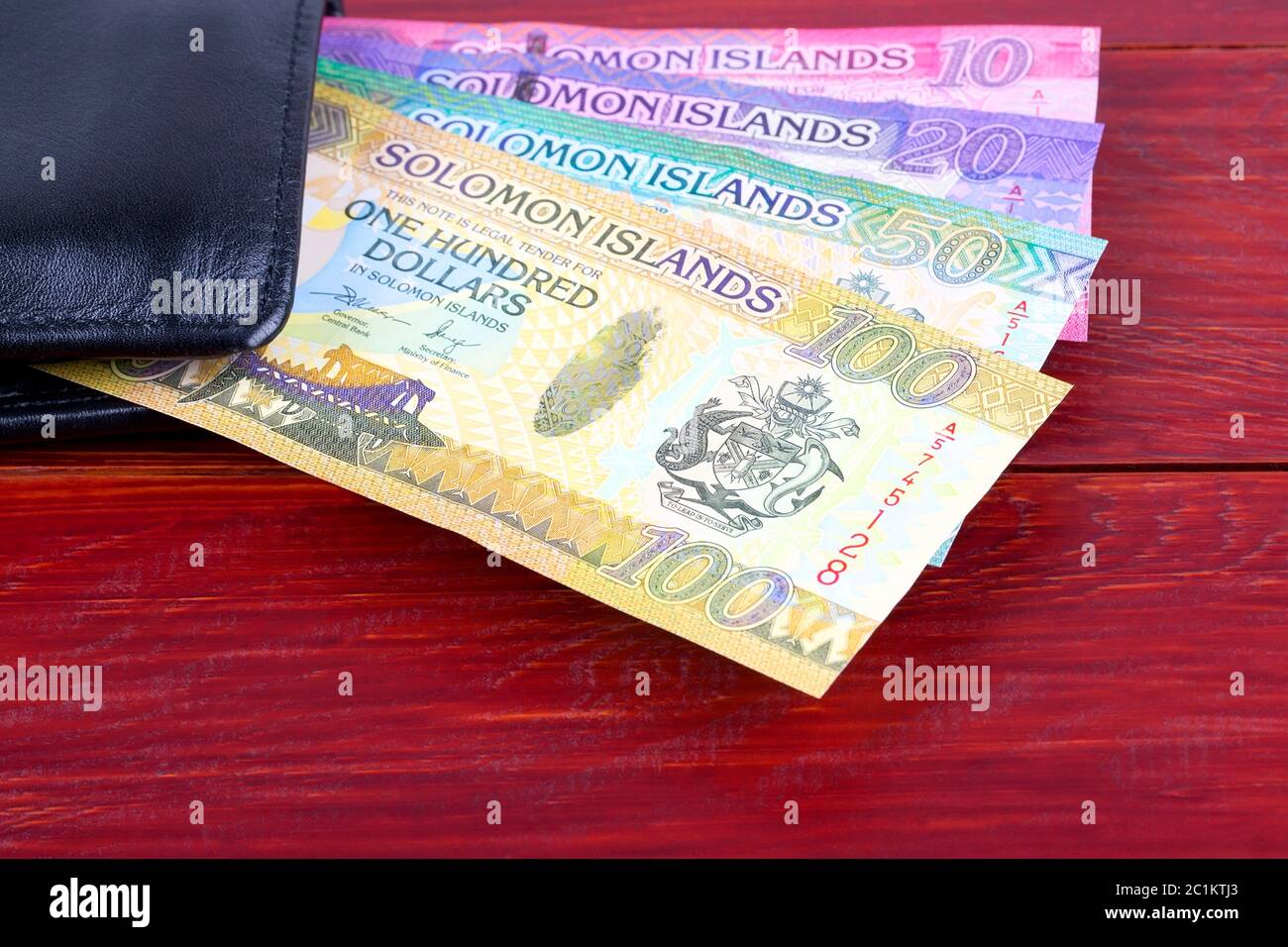 Solomon Islands Dollar in the black wallet Stock Photo - Alamy