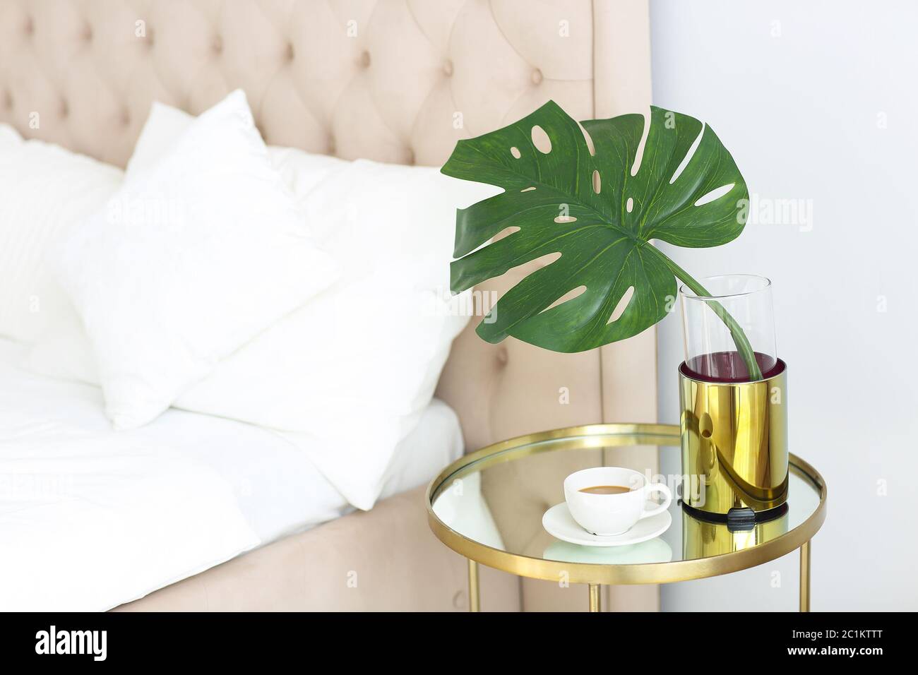 Modern bedroom with table side and pillows and coffee Stock Photo - Alamy