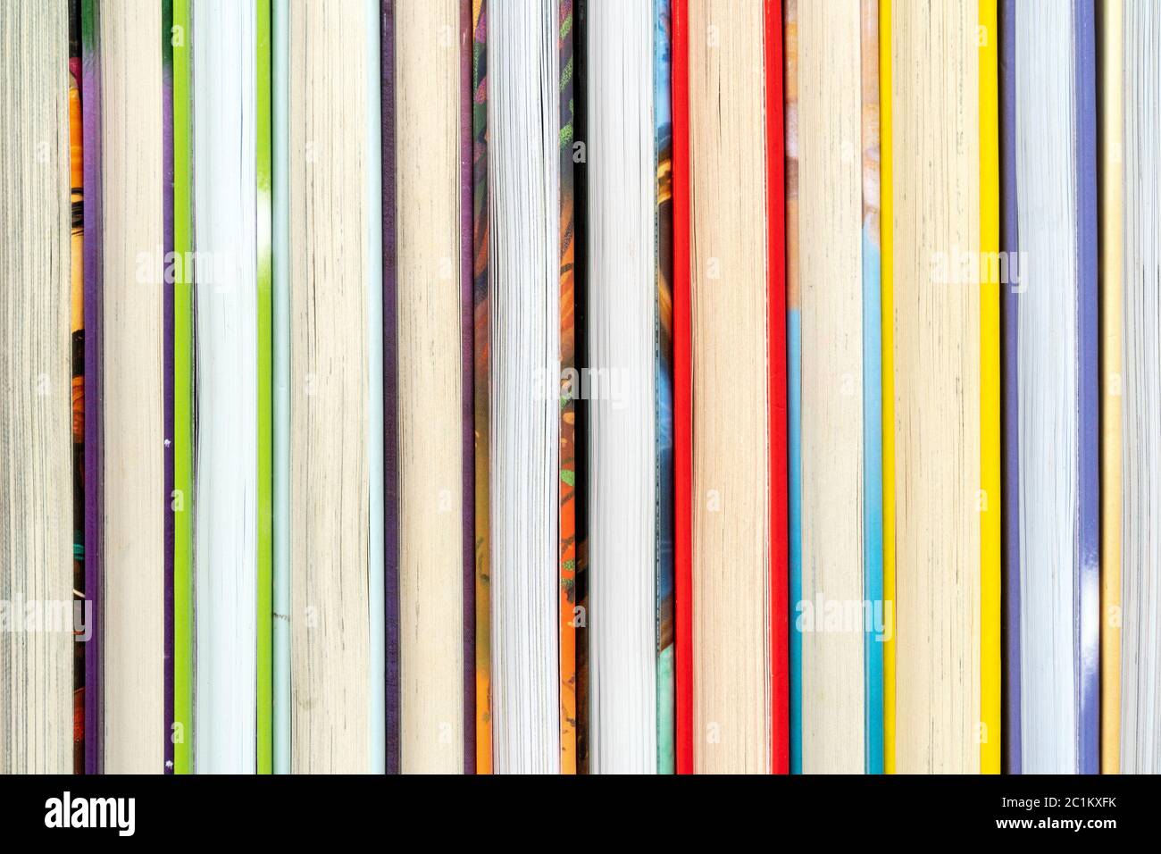Books arranged in a row Stock Photo - Alamy