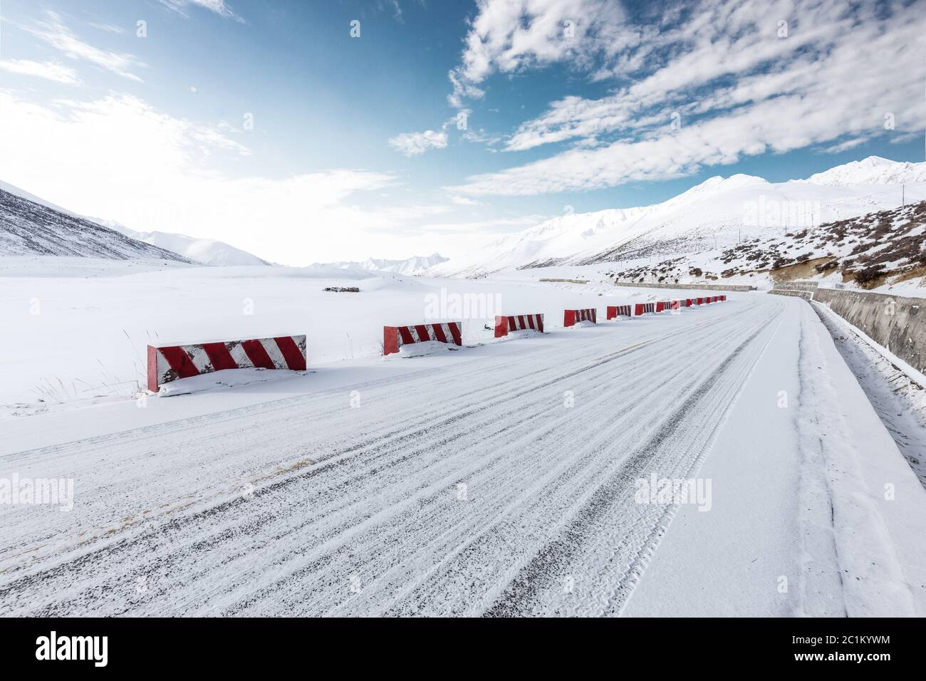 highway covered snow through mountain Stock Photo - Alamy