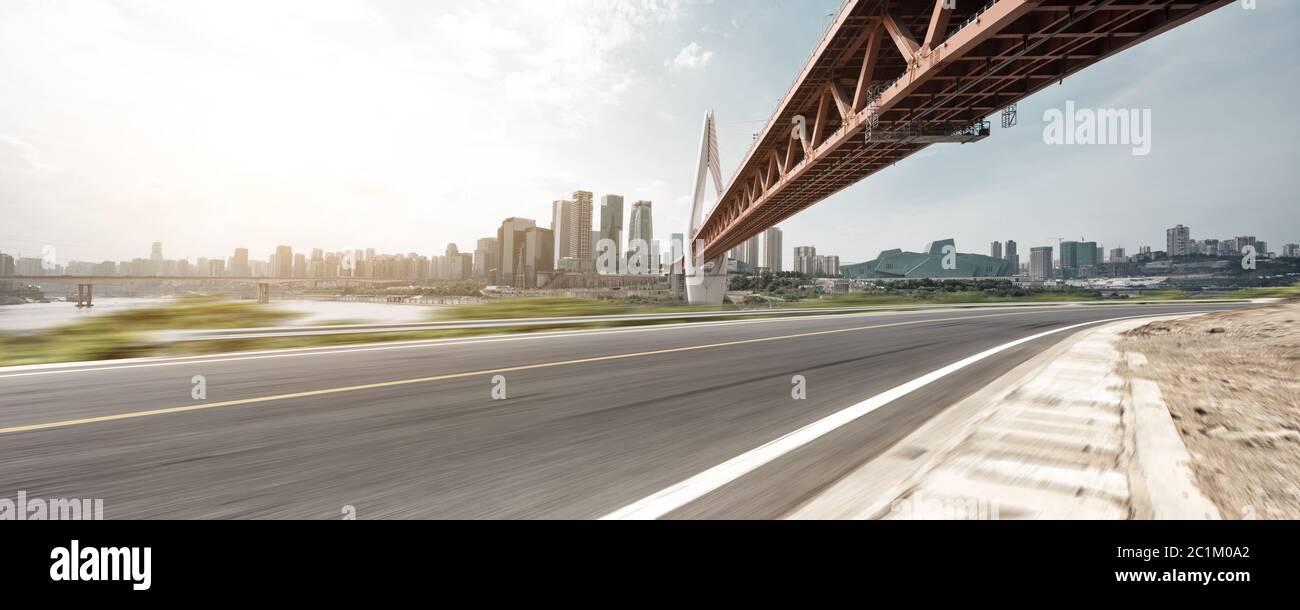 empty asphalt highway through modern city Stock Photo - Alamy