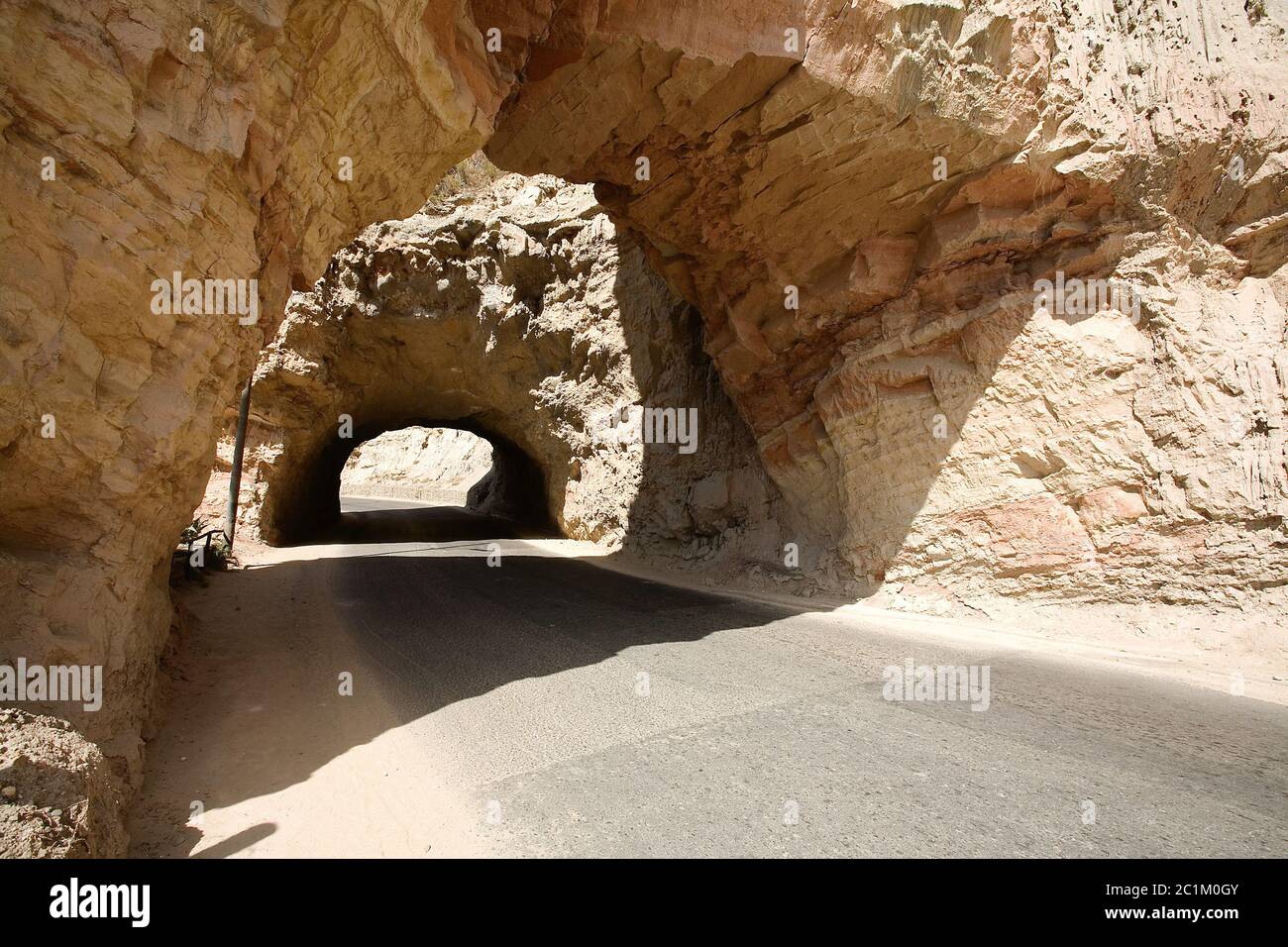 Tunnel under stones Stock Photo - Alamy