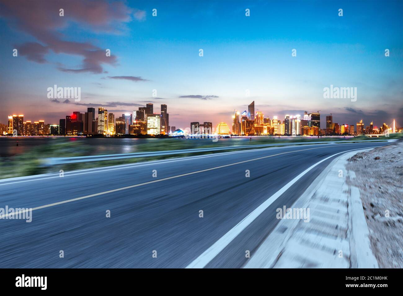 empty asphalt highway through modern city Stock Photo - Alamy