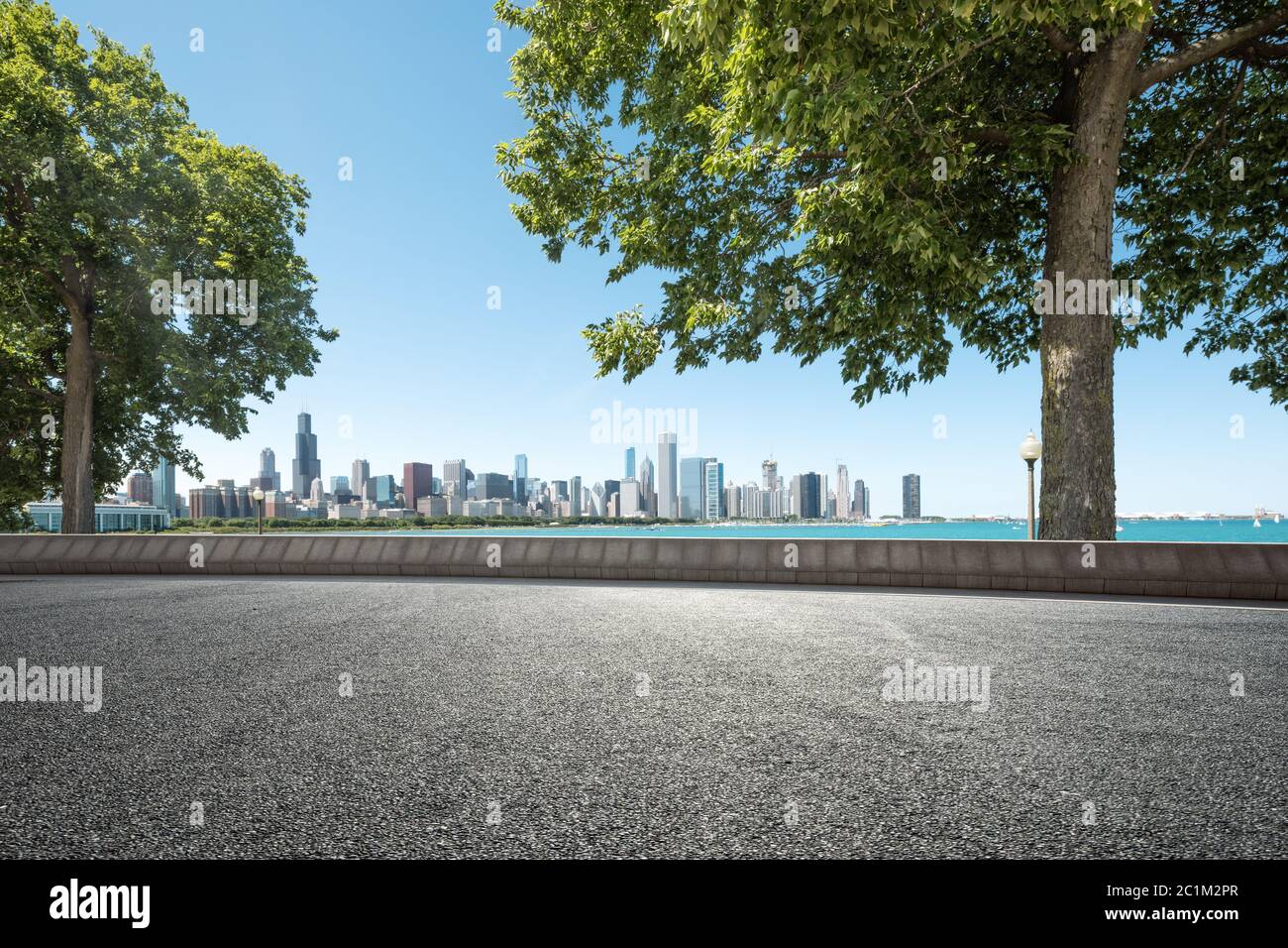 asphalt highway through garden with skyline Stock Photo - Alamy