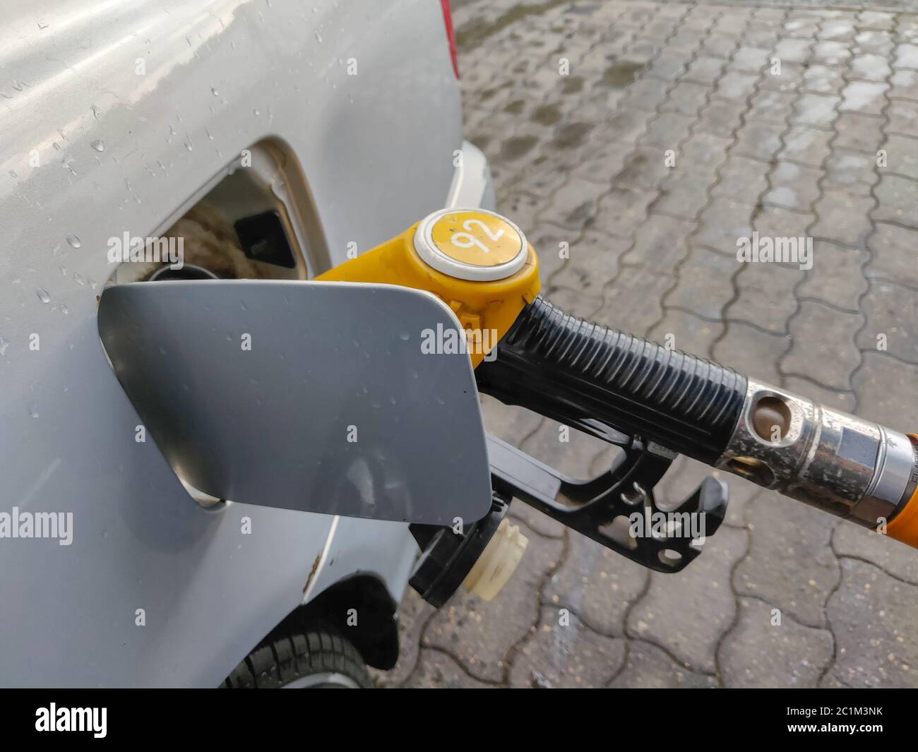 Refueling the car with diesel oil at petrol station Stock Photo - Alamy