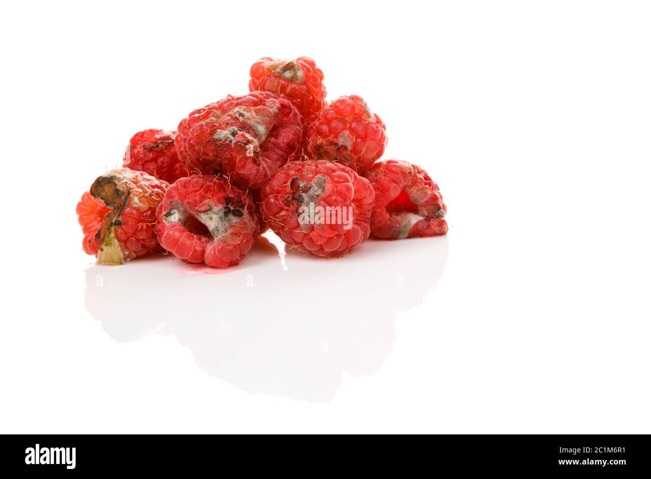 Rotten raspberries on white Stock Photo - Alamy