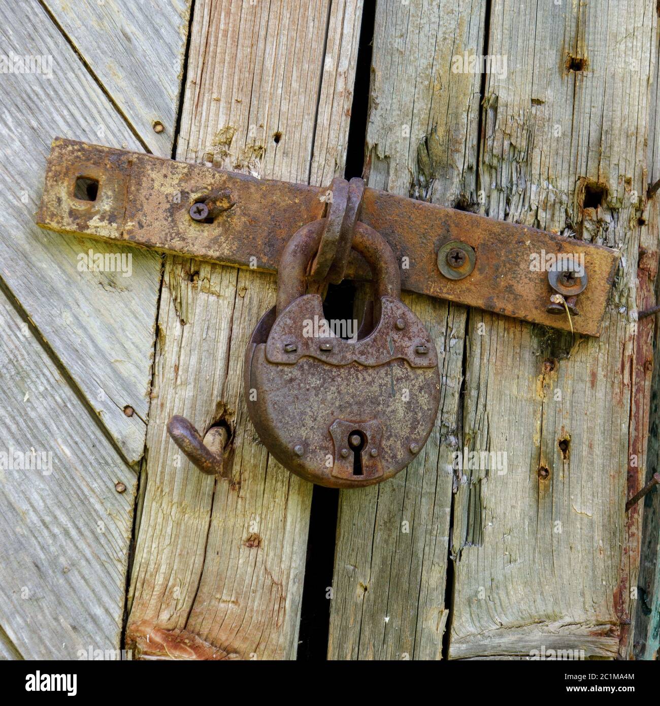 Old lock on the door. lock on the door of an old farmhouse . true ...