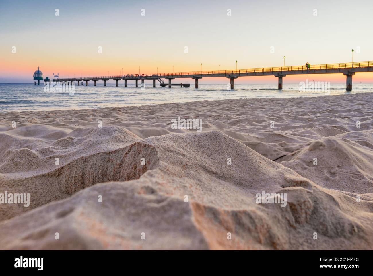 beach, drip castle, pier, bridge Zinnowitz in the sunrise, Baltic Sea ...