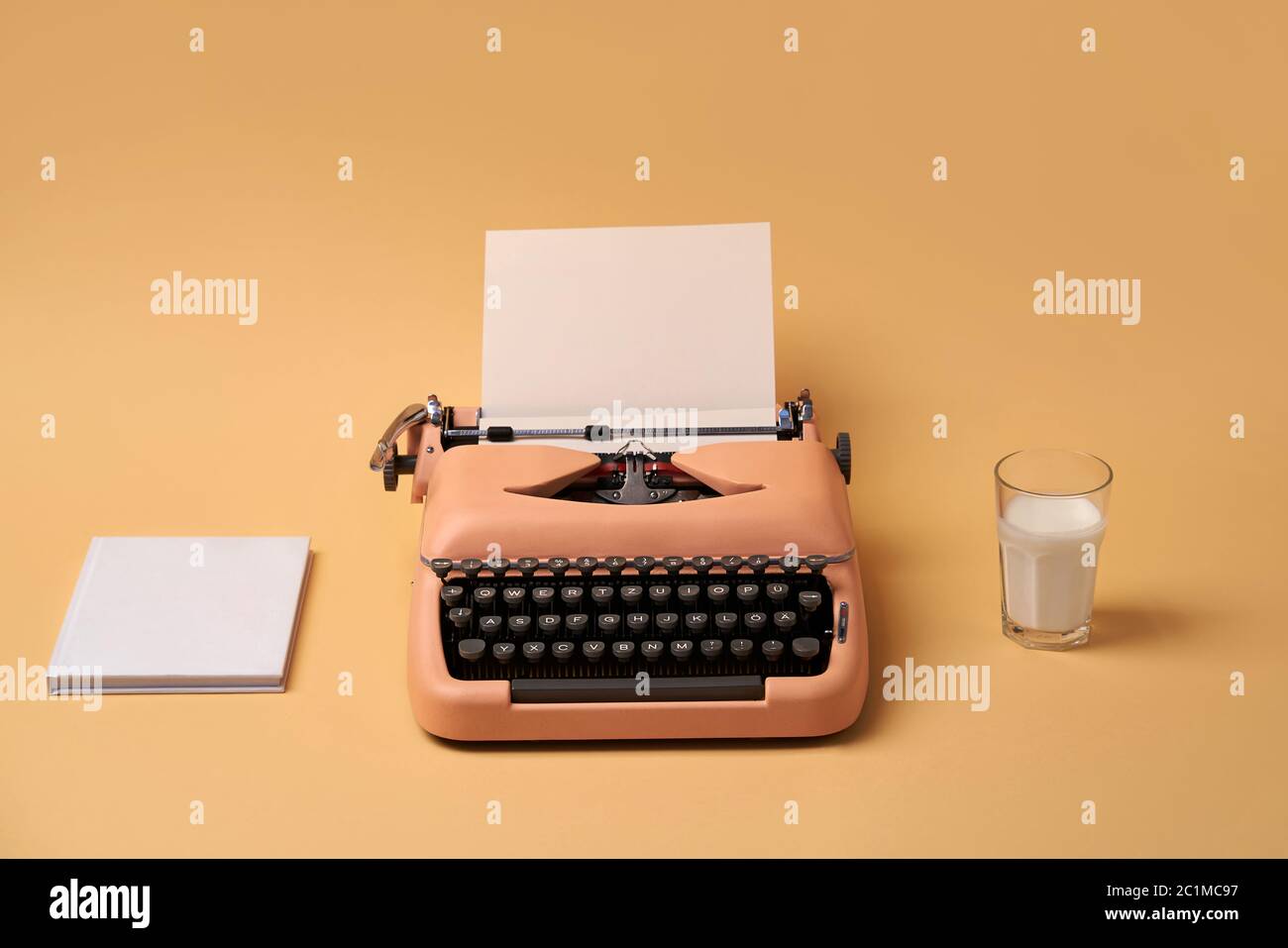 Composition with typewriter, book and glass. Studio shoot Stock Photo ...