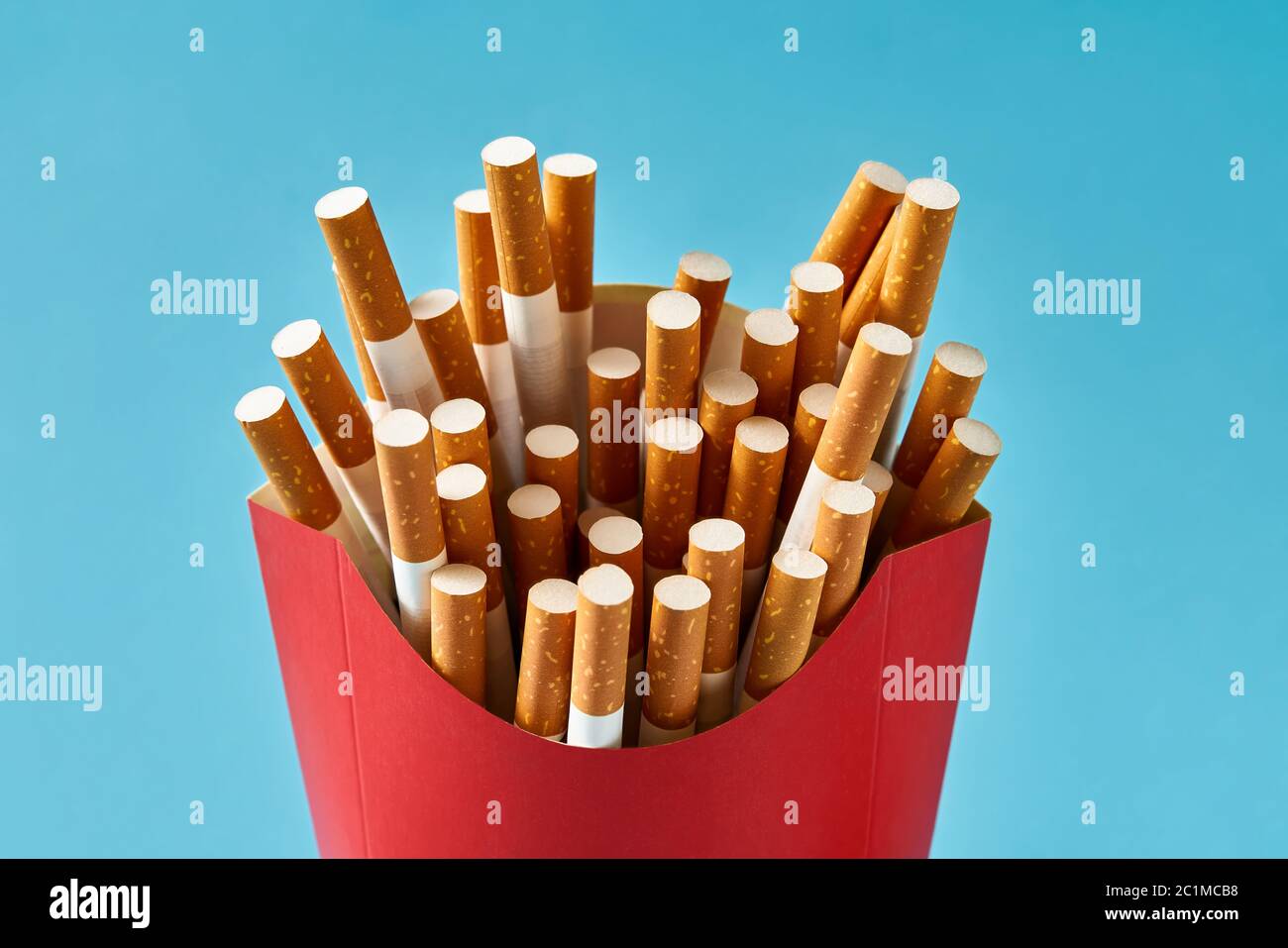 Many cigarettes in red carton, isolated studio shoot Stock Photo - Alamy