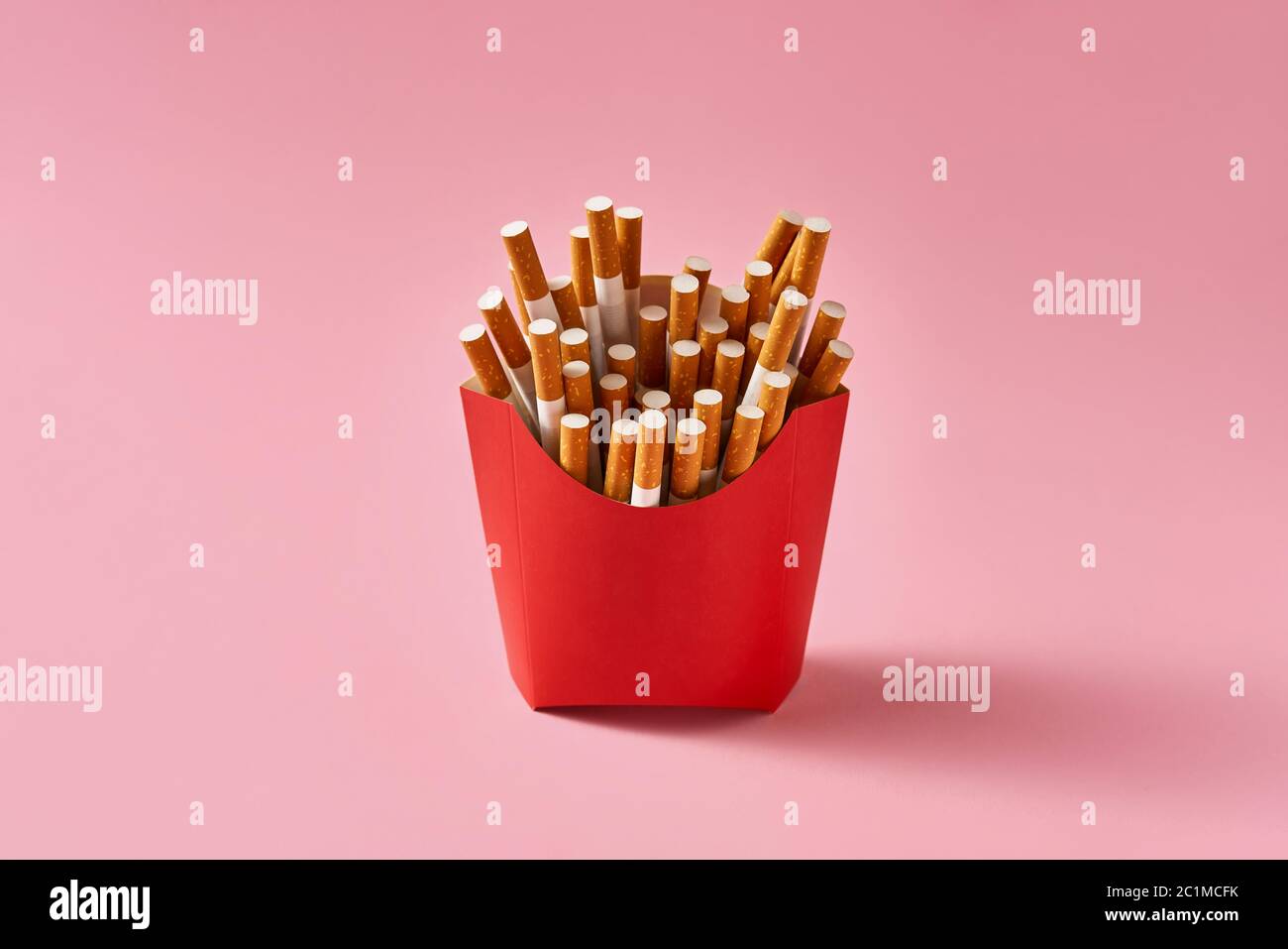 Many cigarettes in red carton, isolated studio shoot Stock Photo - Alamy