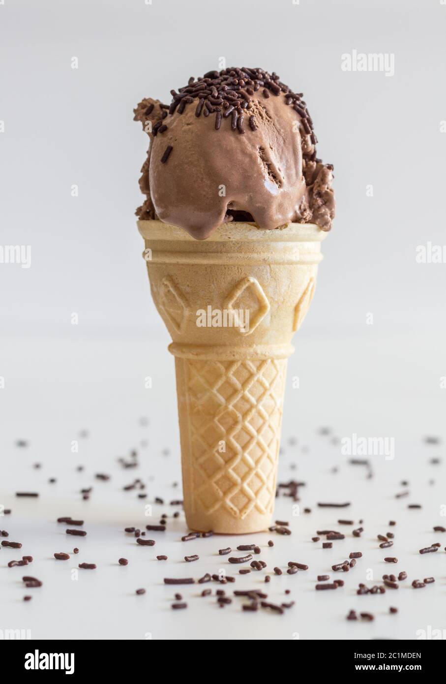 Ice cream flat bottomed single cone standing on white background ...