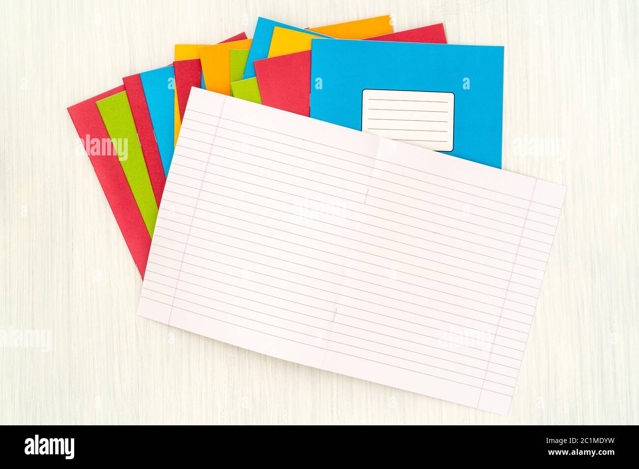 Pile of colored exercise books Stock Photo - Alamy