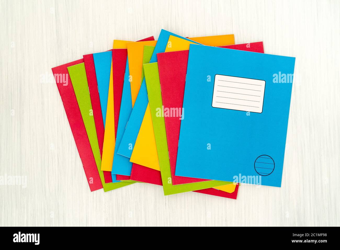 School exercise books pile hi-res stock photography and images - Alamy