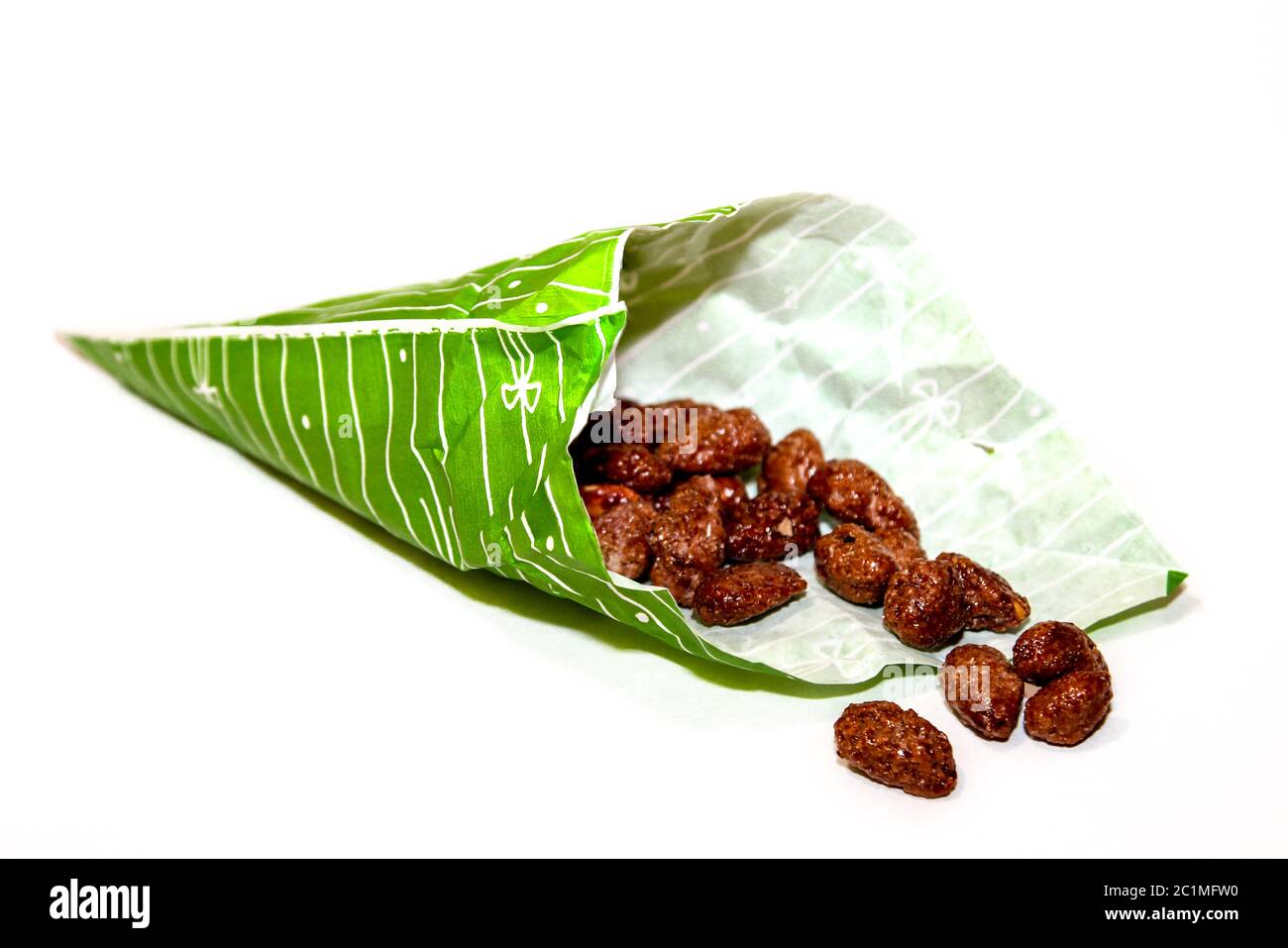 roasted almonds in a green paper bag Stock Photo - Alamy
