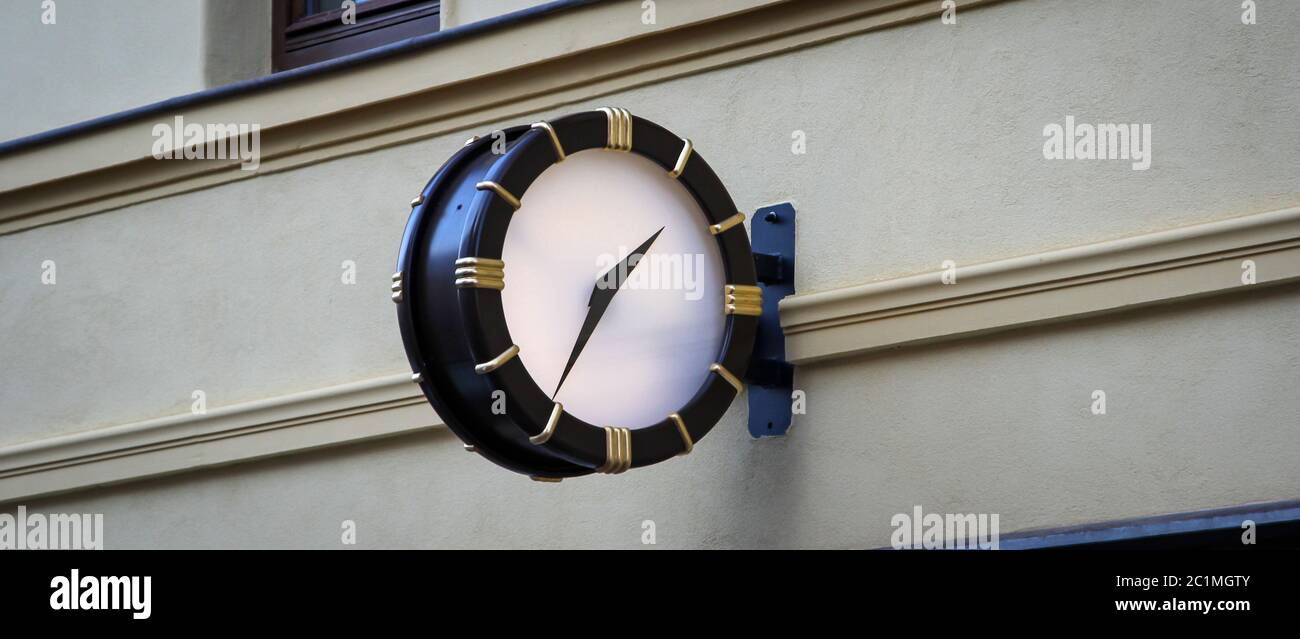 Clock at a house from a public place Stock Photo - Alamy
