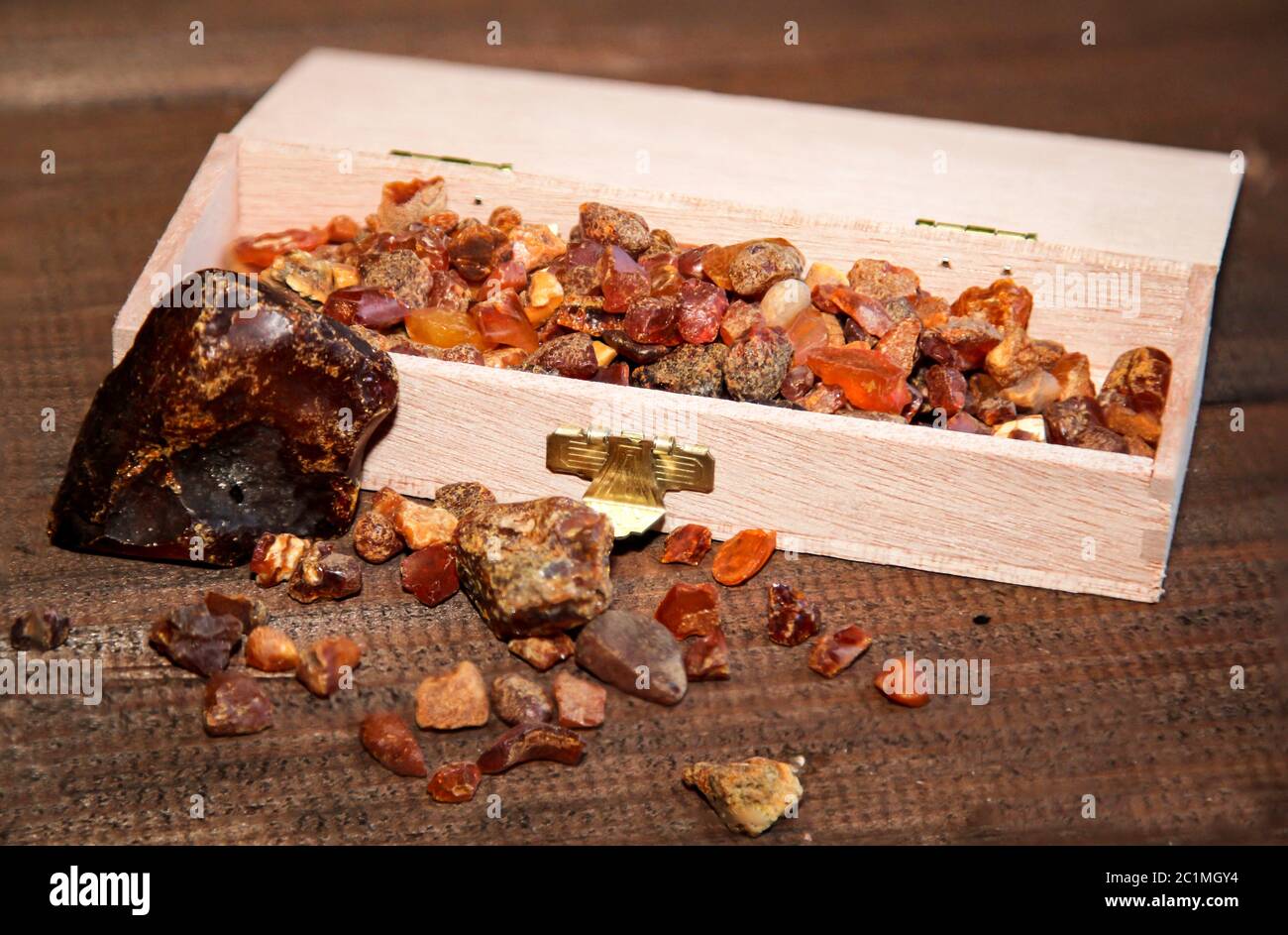 Amber in a wooden box Stock Photo - Alamy