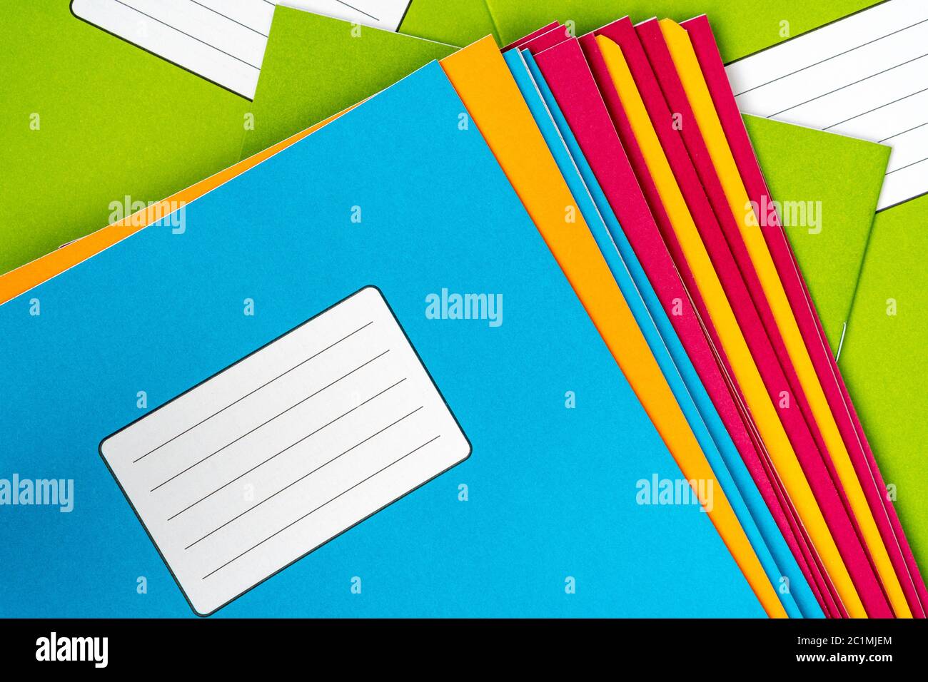 School exercise books pile hi-res stock photography and images - Alamy