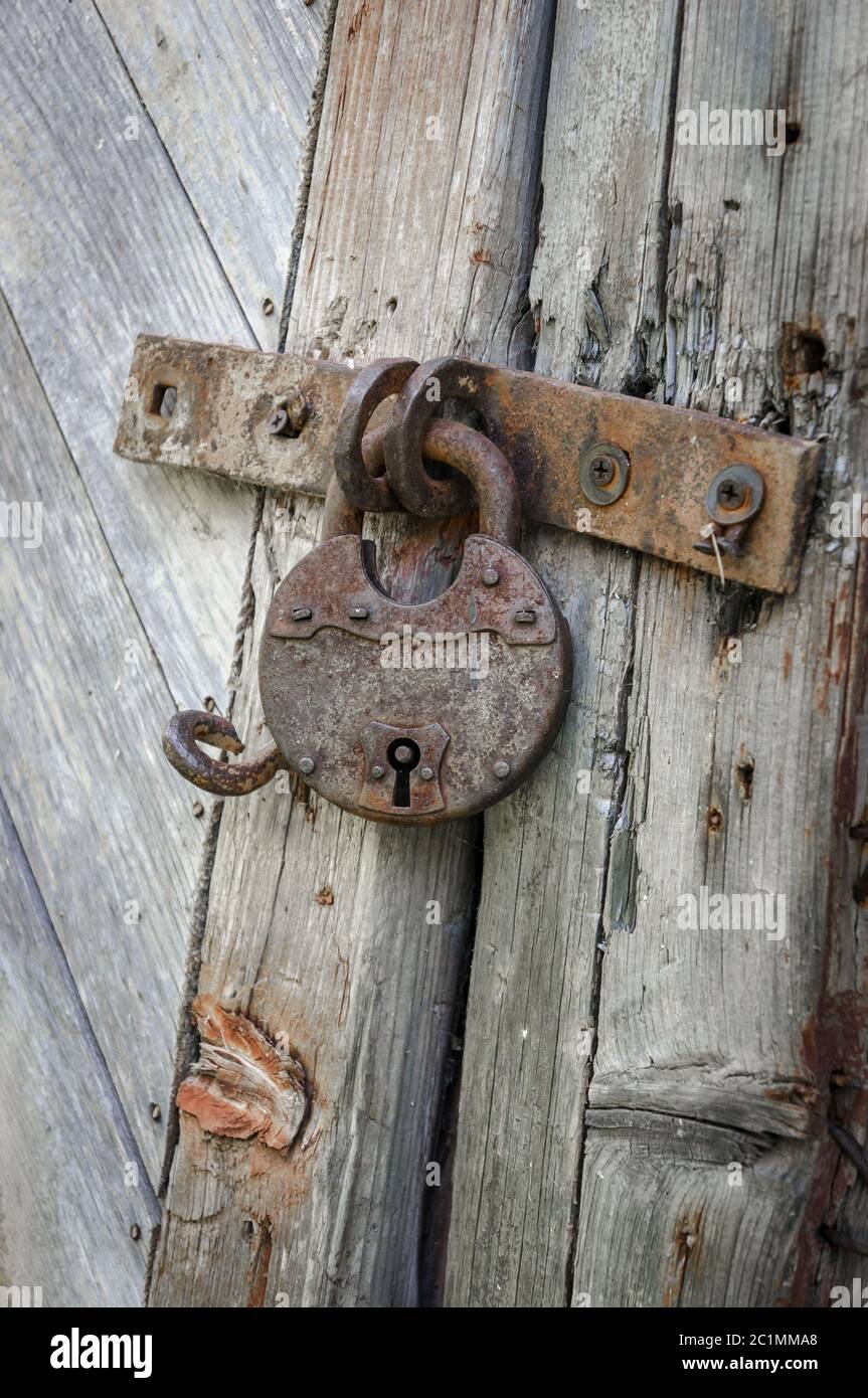 Old lock on the door. lock on the door of an old farmhouse . true ...