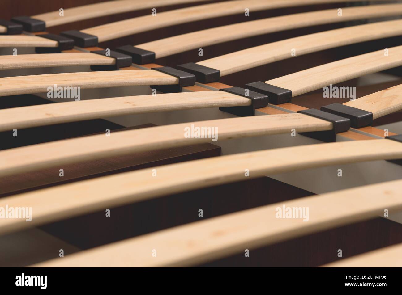 Close-up wooden elements of an arthopedic base of a double bed ...