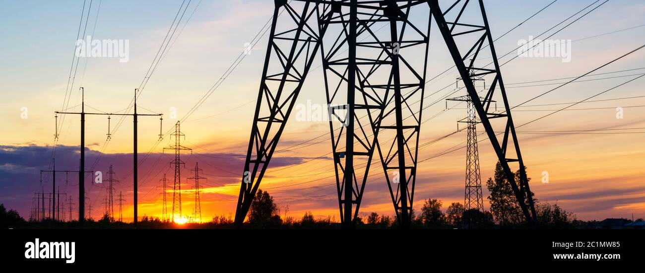 Power lines at the sunset header. Electricity distrubution end ...