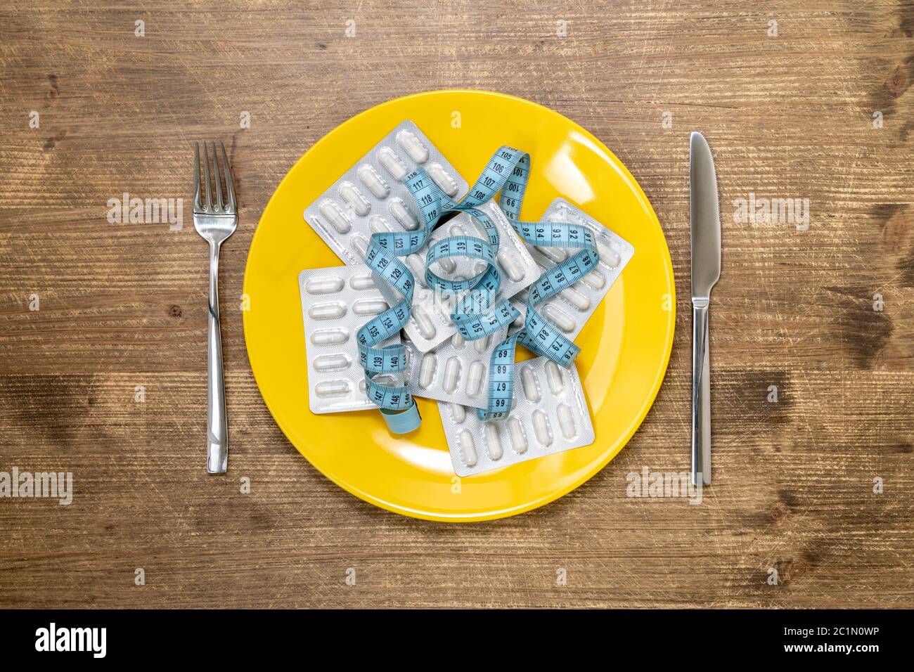 Pills measuring tape concept hi-res stock photography and images - Alamy