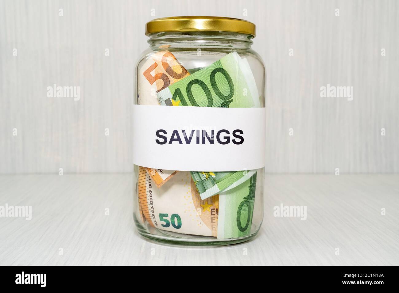Banknotes in glass money jar Stock Photo - Alamy