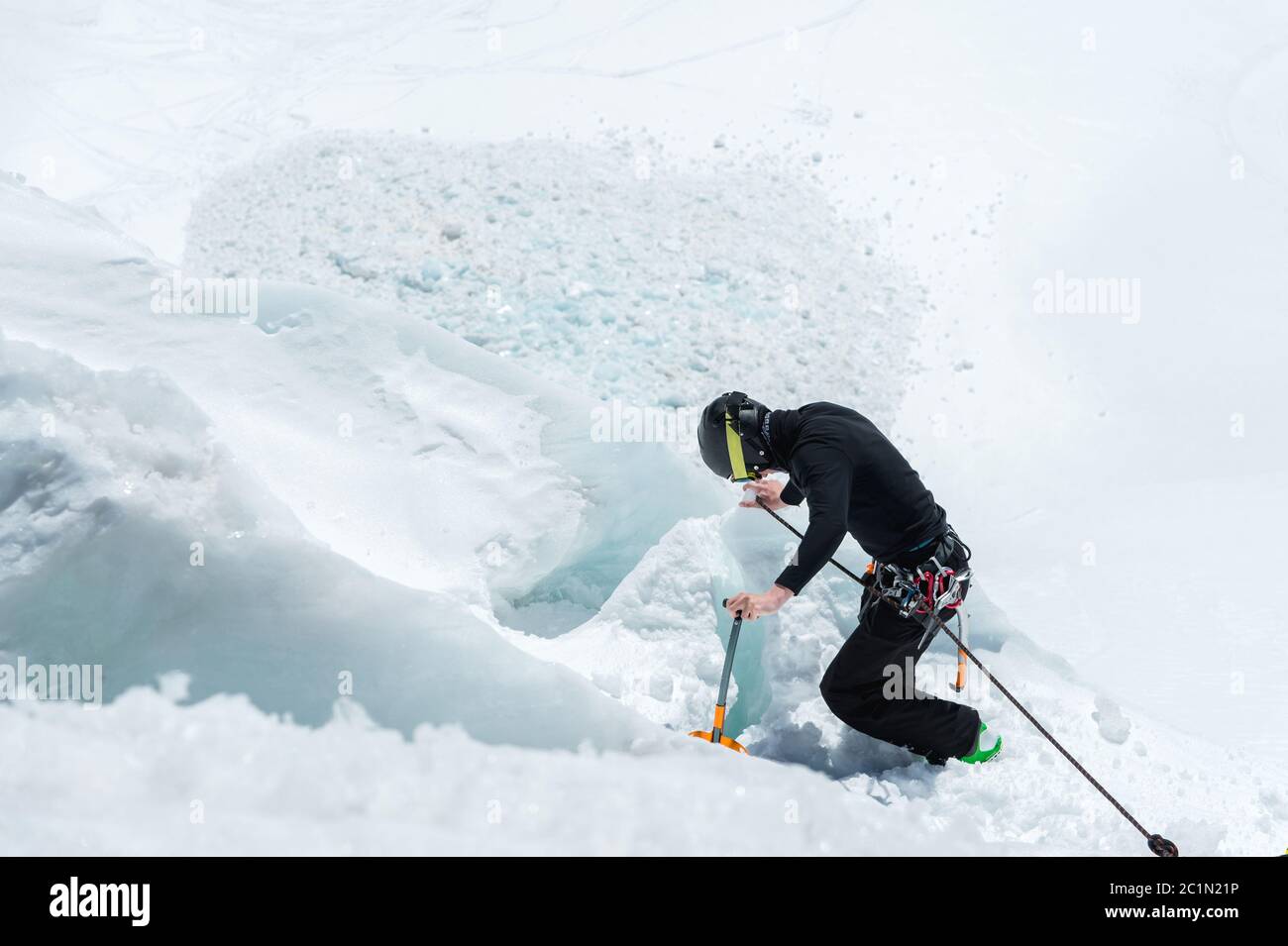 Mountain guide candidate training ice axe and rope skills on a glacier ...