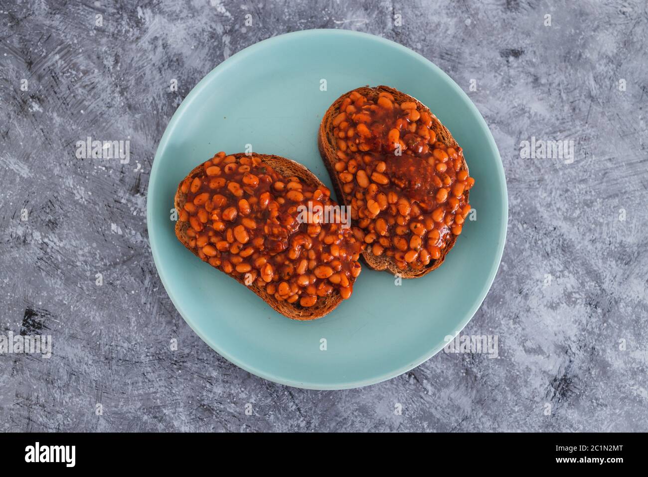 healthy plant-based food recipes concept, baked beans on rye bread ...