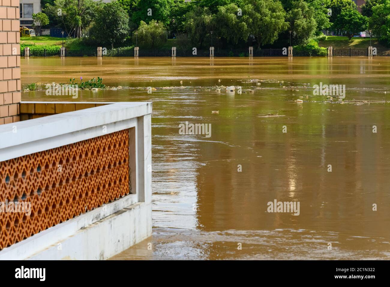 flood with lots of man made trashes floating Stock Photo - Alamy