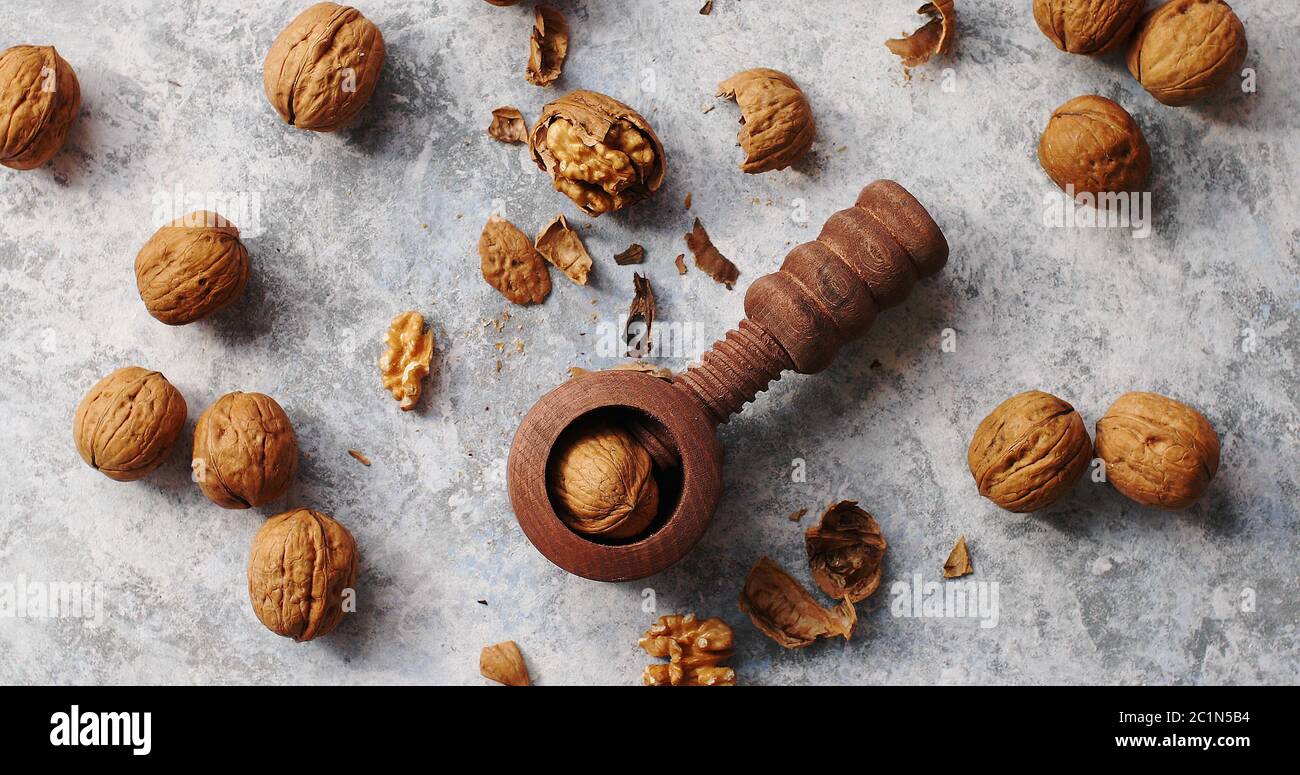 Wooden cracker with walnuts in composition Stock Photo - Alamy