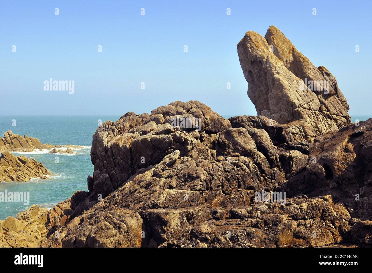 Rocky reef in the sea Stock Photo - Alamy