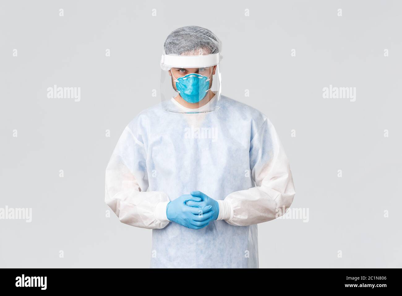 Covid-19, pandemic, healthcare workers fighting virus outbreak. Male ...