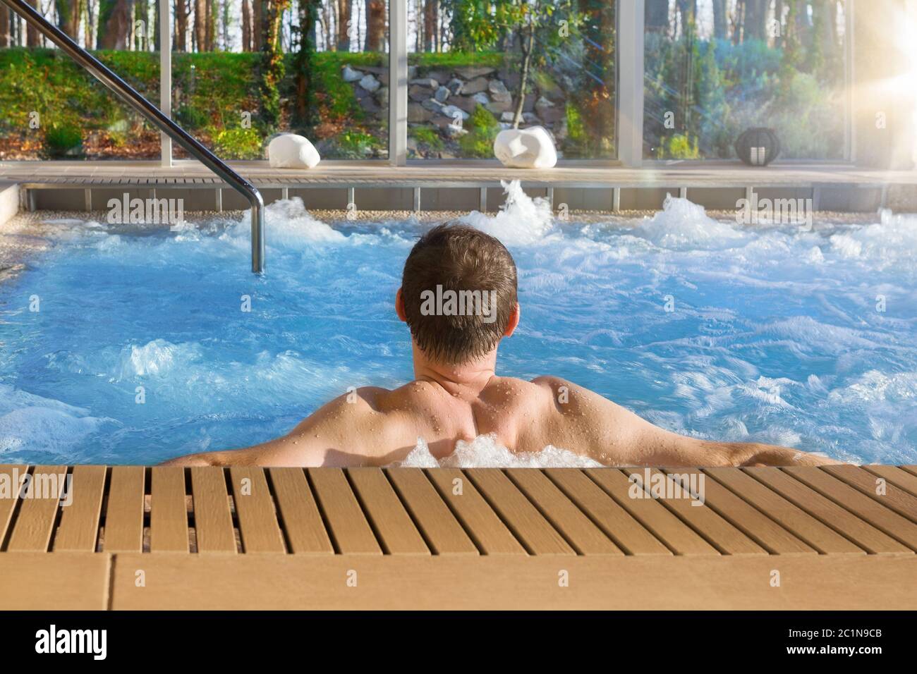 Back man hot tub hi-res stock photography and images - Alamy