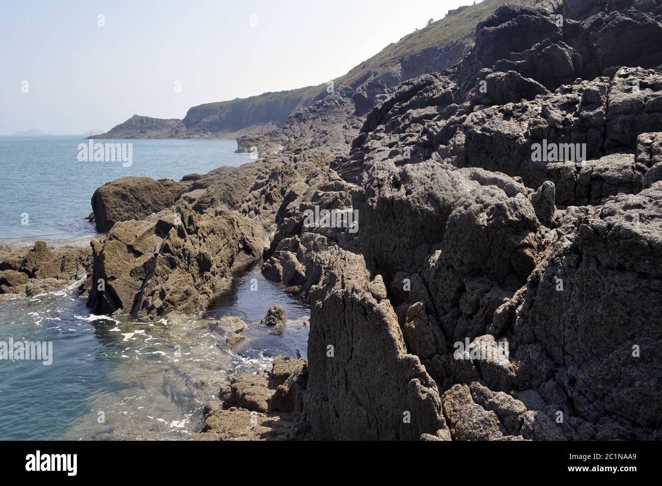 Rocky reef in the sea Stock Photo - Alamy