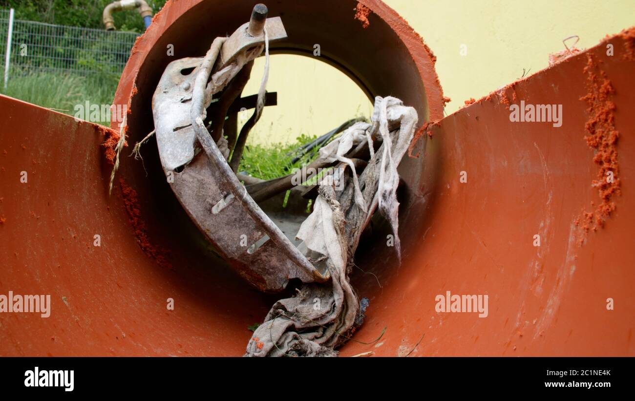 Strainer was bent and wedged in a sewer pipe Stock Photo - Alamy
