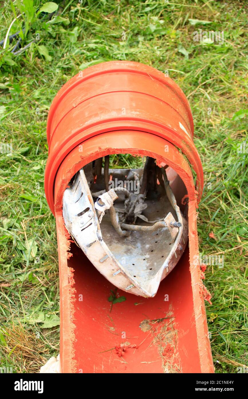 Strainer was bent and wedged in a sewer pipe Stock Photo - Alamy