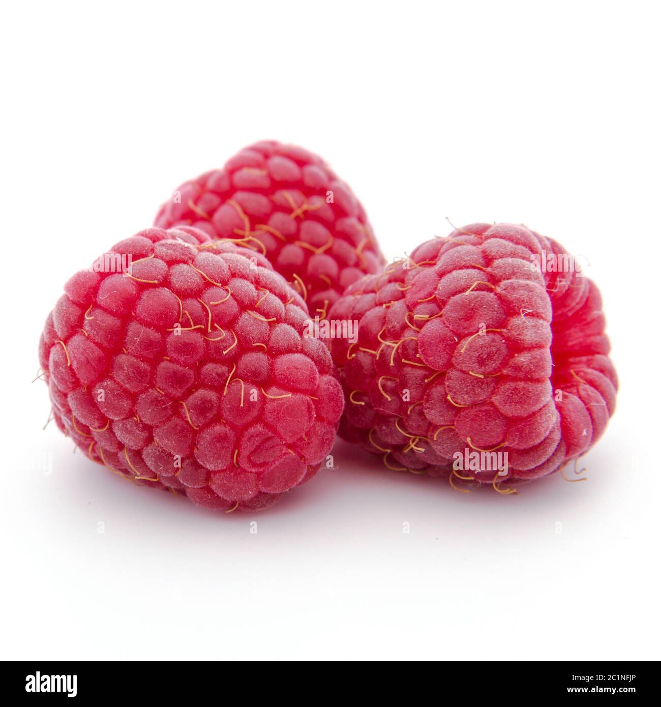 Raspberries isolated on white background Stock Photo - Alamy