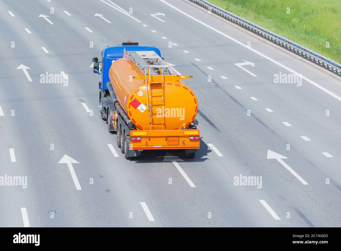 Freight truck with tank moves on the highway Stock Photo - Alamy