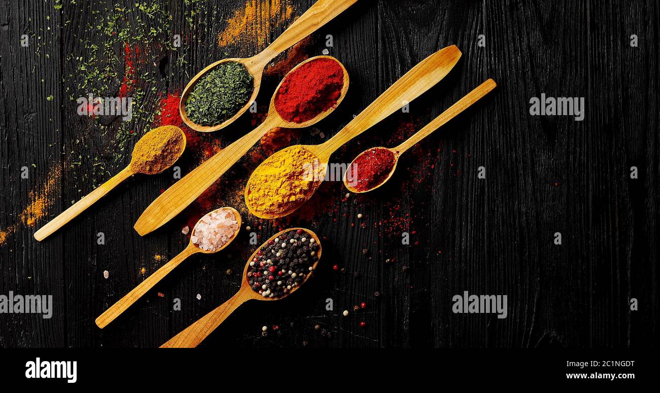 Different spices placed in spoons Stock Photo - Alamy