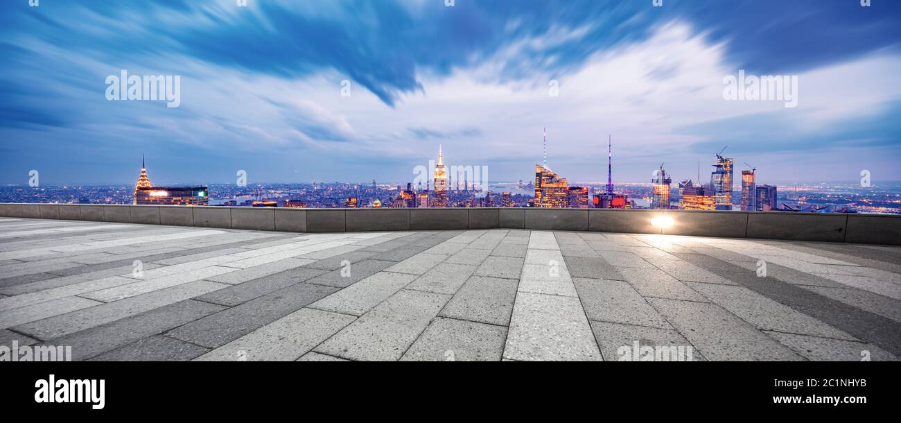 empty ground with modern cityscape new york at night Stock Photo - Alamy