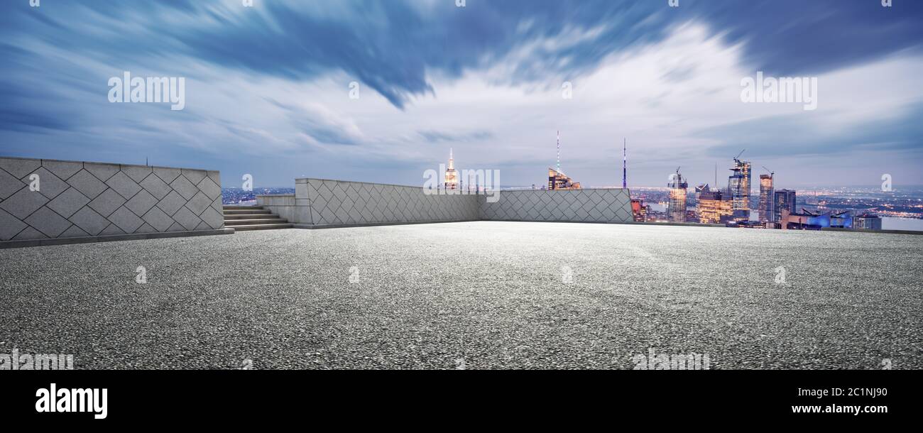 empty ground with modern cityscape new york at night Stock Photo - Alamy