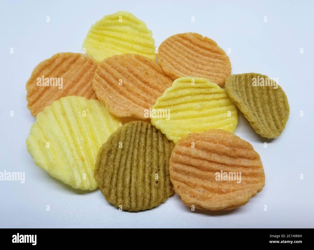 Variety colors of vegetable chips on a white isolated background Stock ...