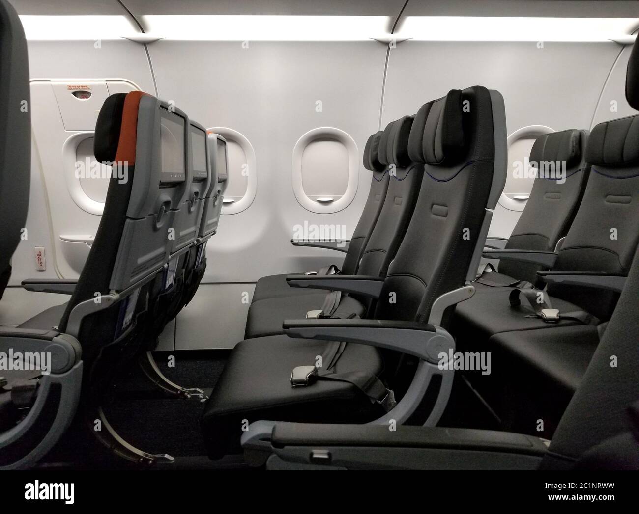 Tiny airplane seat hi-res stock photography and images - Alamy