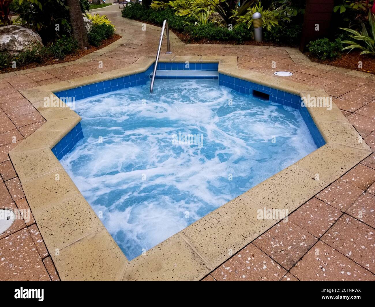 The top view of blue hot tub with rushing water Stock Photo - Alamy