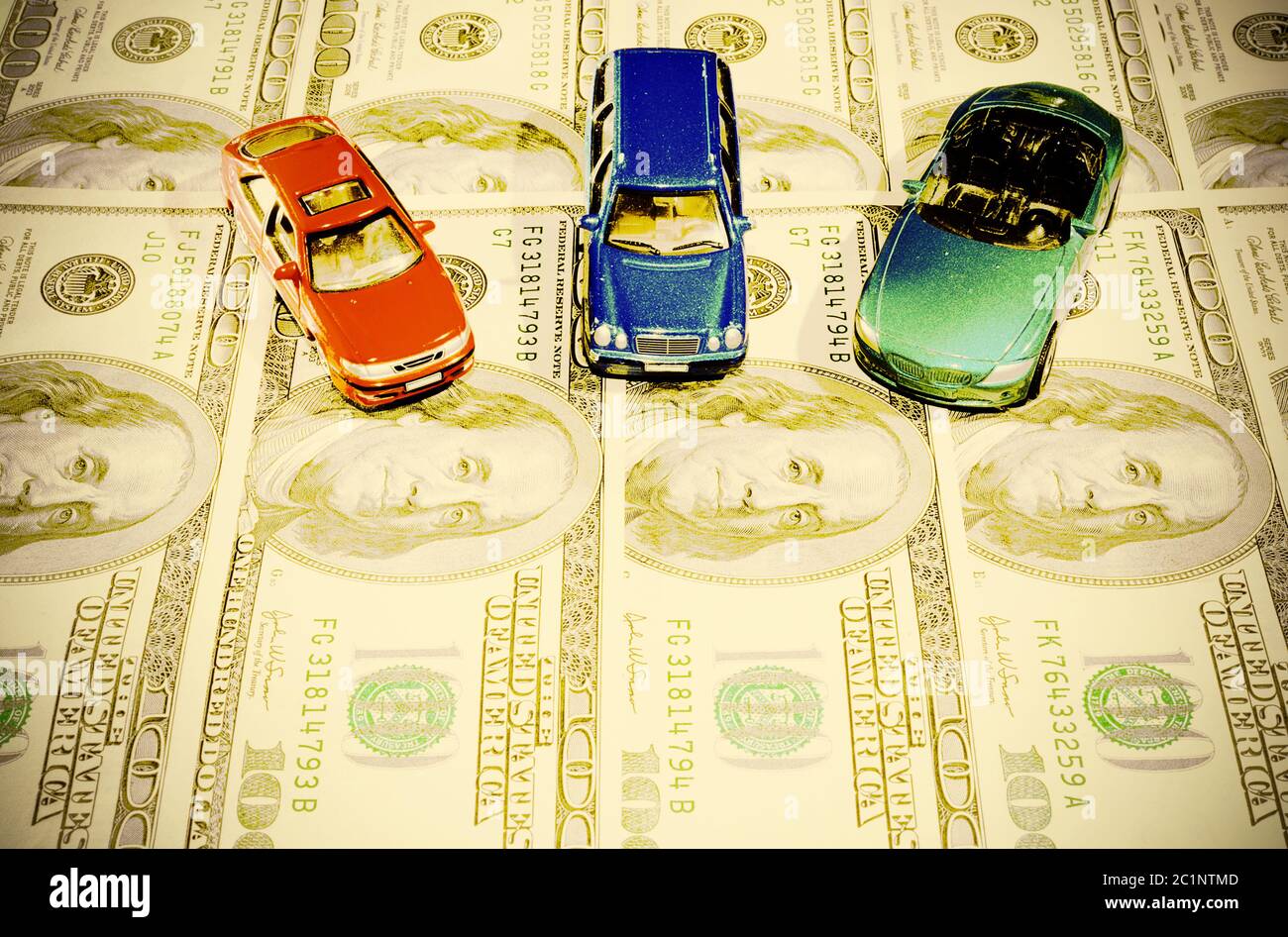Cars on the dollar banknotes Stock Photo - Alamy