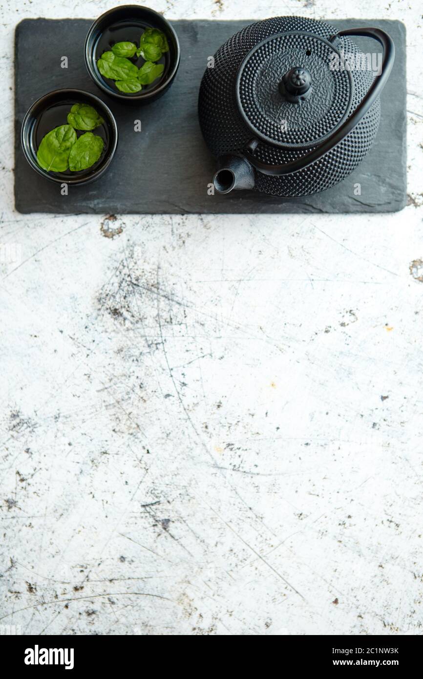 Traditional eastern metal teapot and iron cups Stock Photo - Alamy